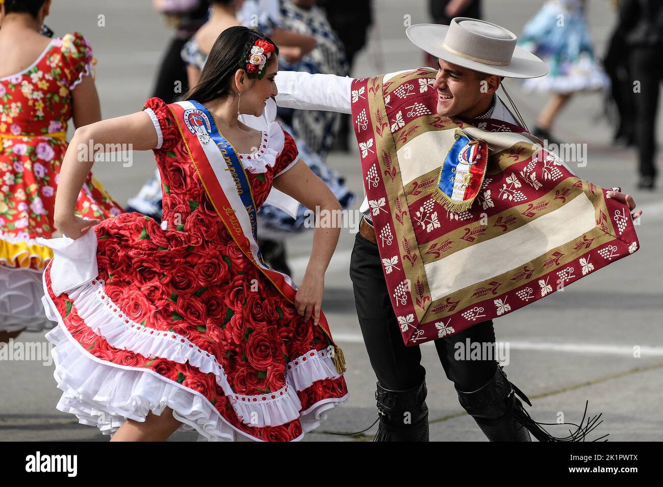 Santiago, Chile. 19th Sep, 2022. Dancers in folk costumes dance before ...