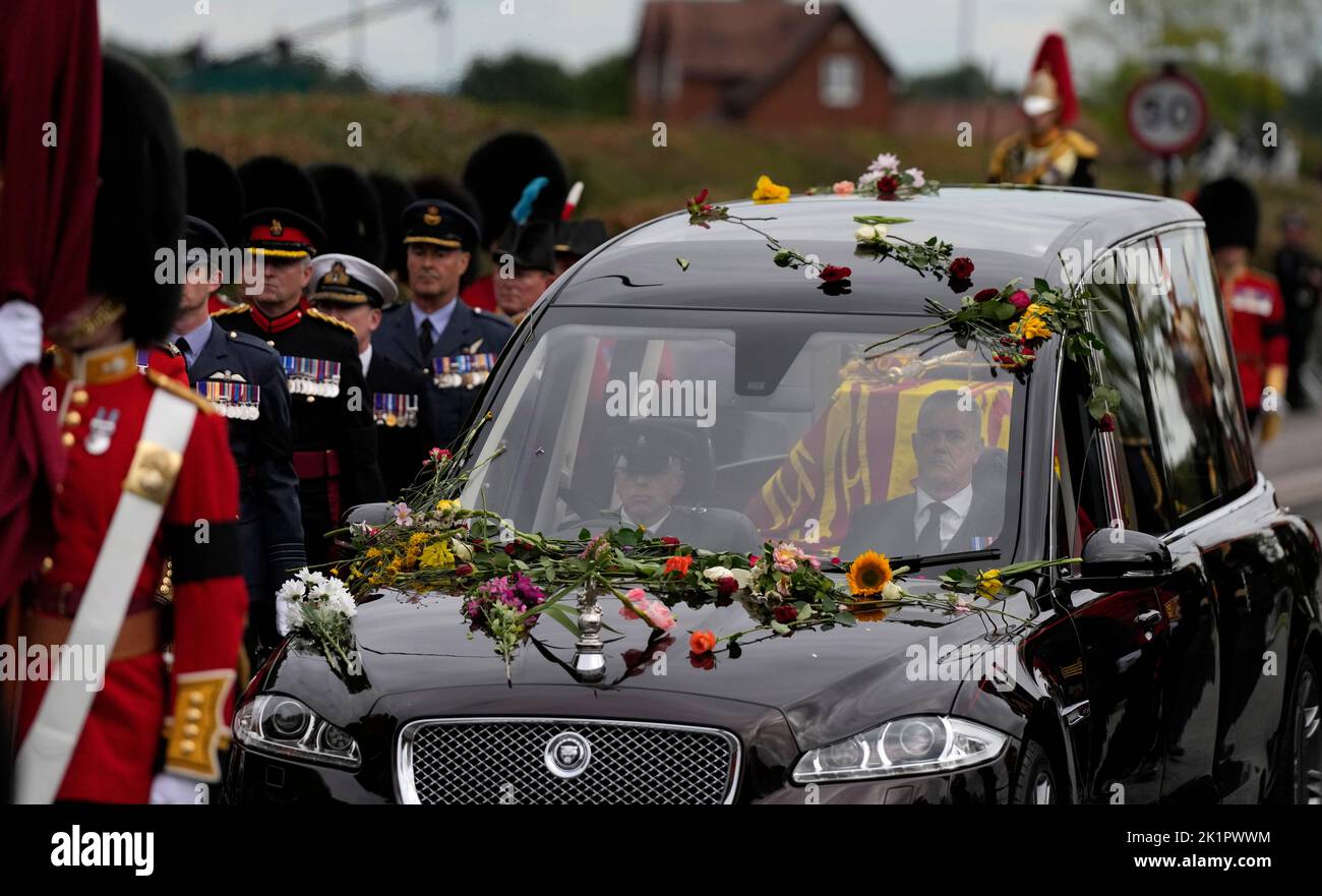 The State Hearse carries the coffin of Queen Elizabeth II, draped in ...