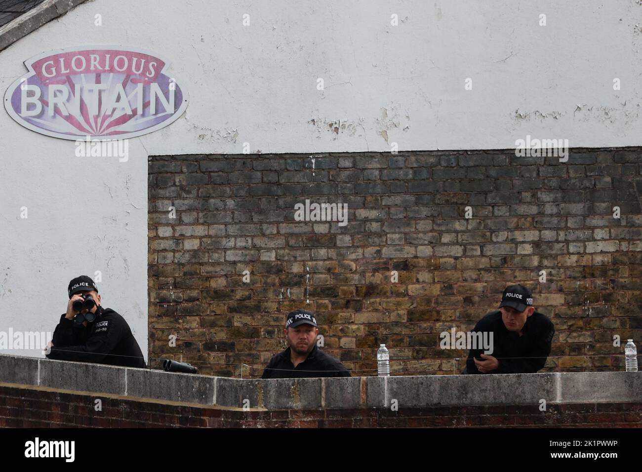 Security police keep watch over the arrivals at St George's Chapel ...