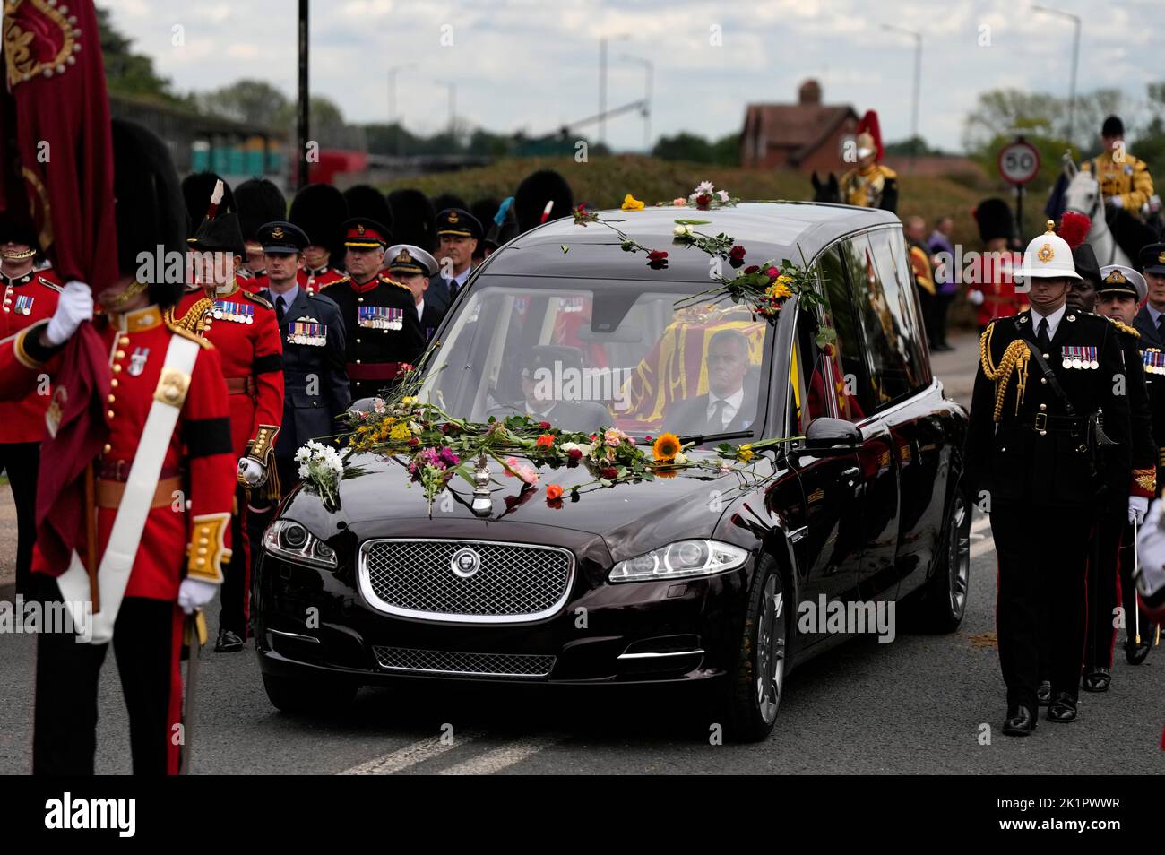 The State Hearse carries the coffin of Queen Elizabeth II, draped in the Royal Standard with the ...