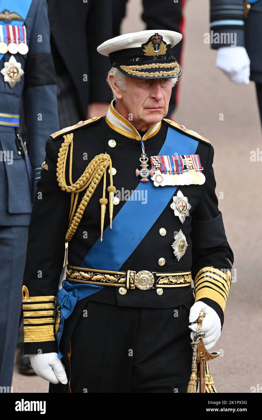 King Charles III joins the Ceremonial Procession of the coffin of Queen Elizabeth II at Windsor ...