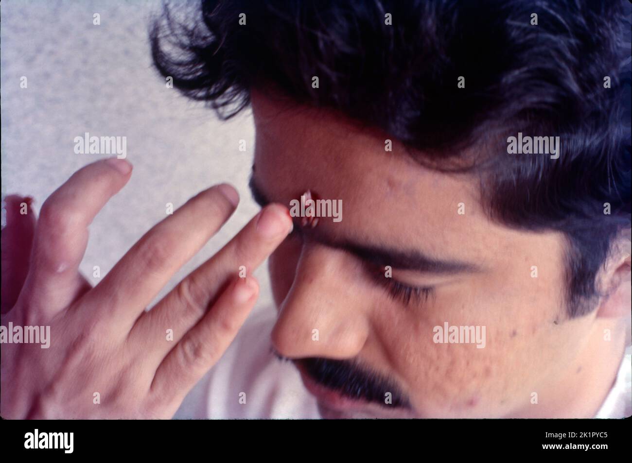 Applying Tilak, Kumkum & Rice, Tilak is placed on the forehead between ...
