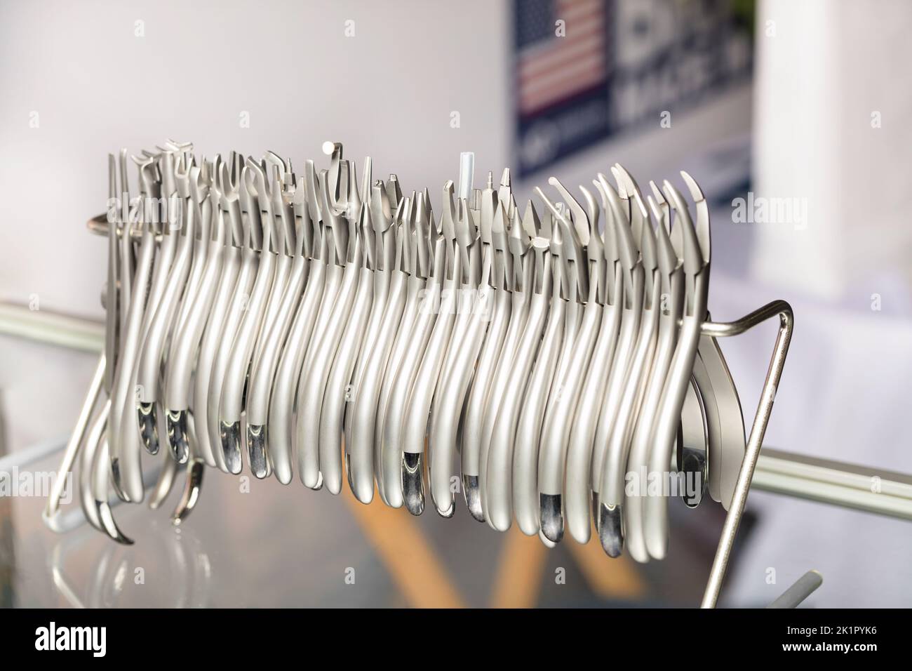 A set of various stainless steel dental instruments. The concept of ...