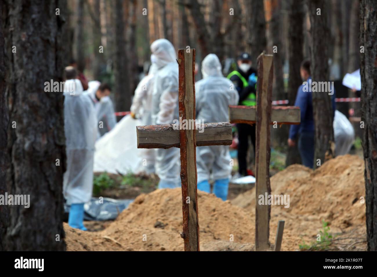 IZIUM, UKRAINE - SEPTEMBER 19, 2022 - The crosses mark the graves of ...