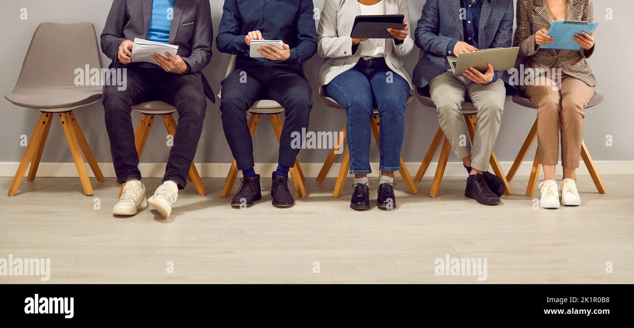 People using laptop and tablet computers while waiting for business ...