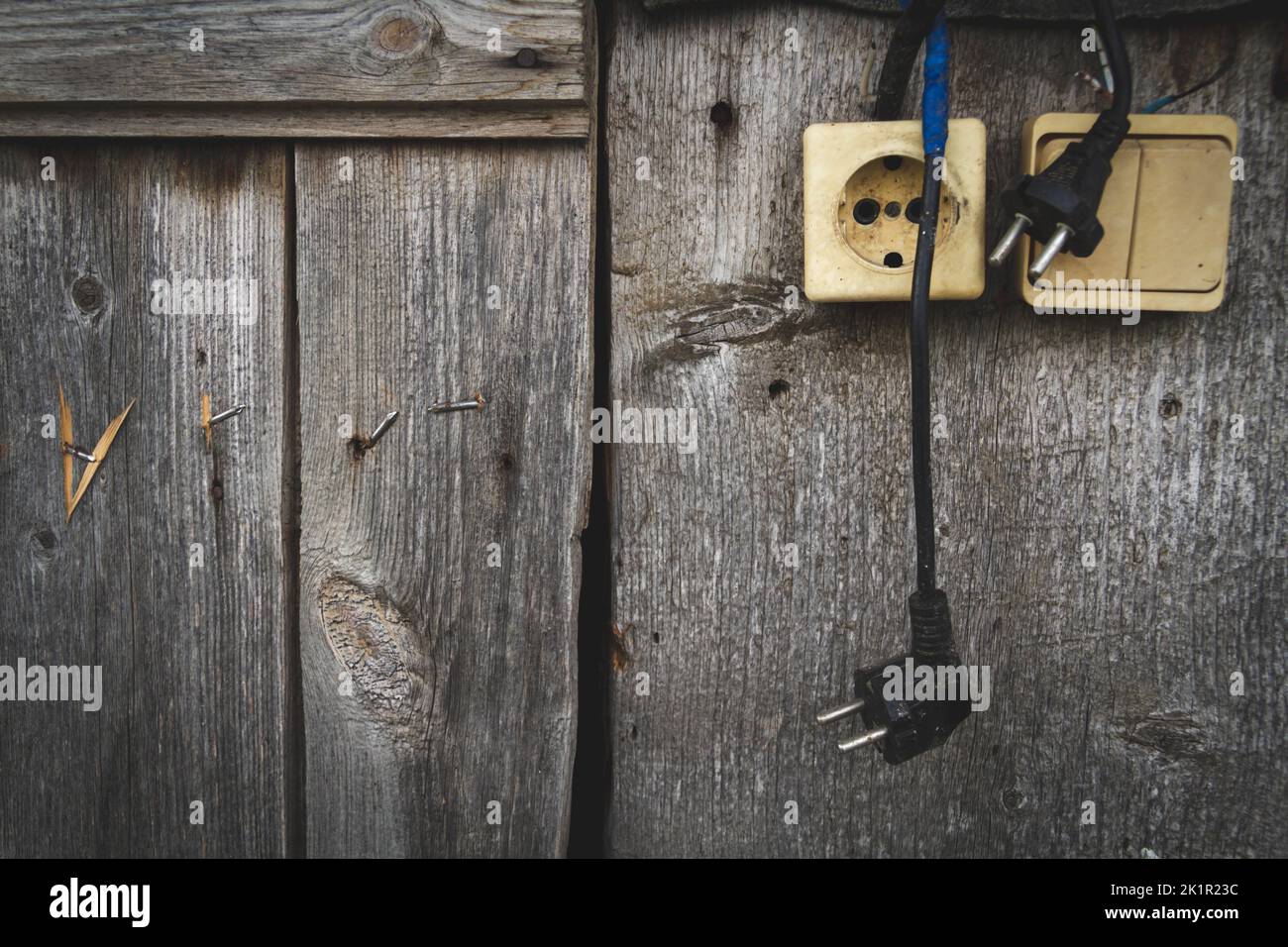 Old socket. Switch and socket. Broken electrical appliances. Dangerous ...