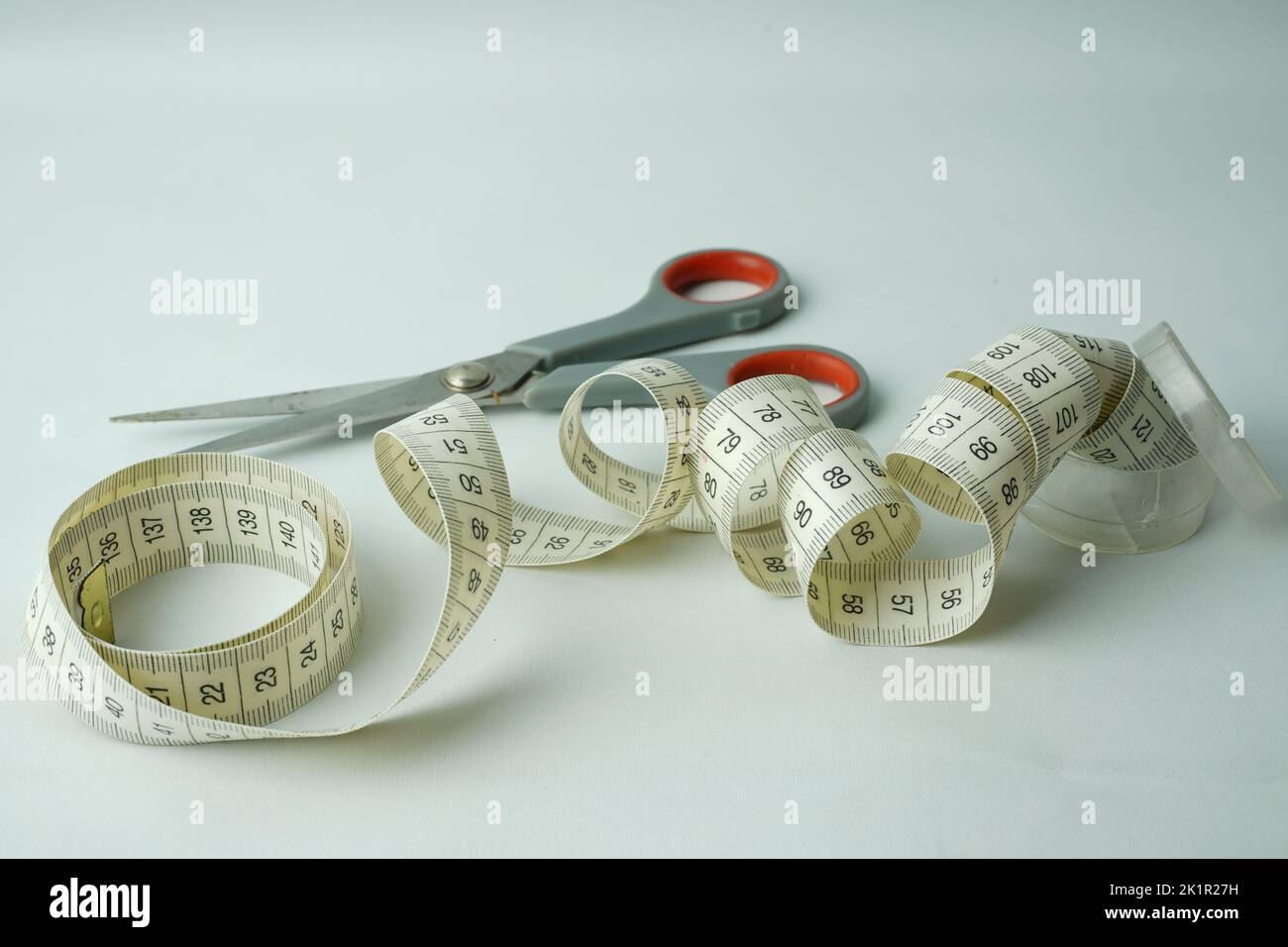 tape measure and fabric scissors Stock Photo - Alamy
