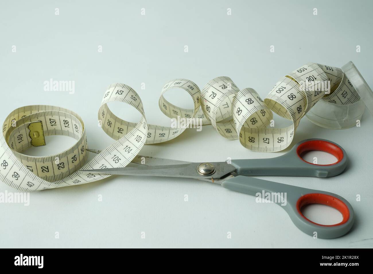 tape measure and fabric scissors Stock Photo - Alamy