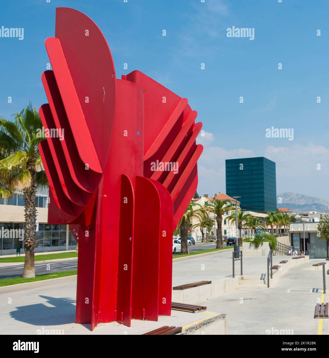 Red sculpture of visual artist Jagoda Buic and glass cube of Hotel ...