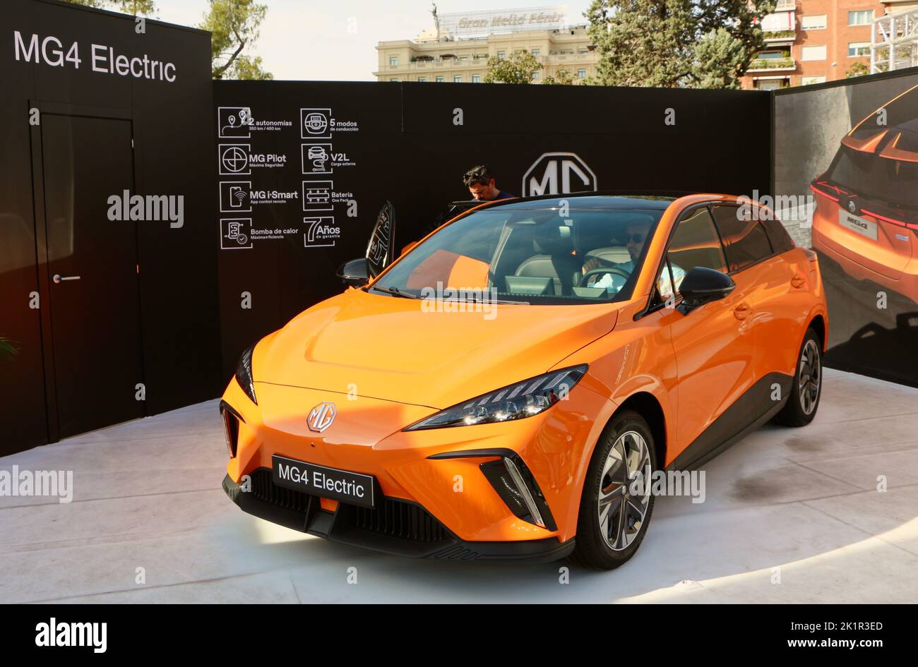 Orange MG4 car on the exhibition stand at the Madrid Electric Vehicle ...