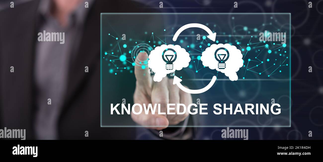Man touching a knowledge sharing concept on a touch screen with his ...