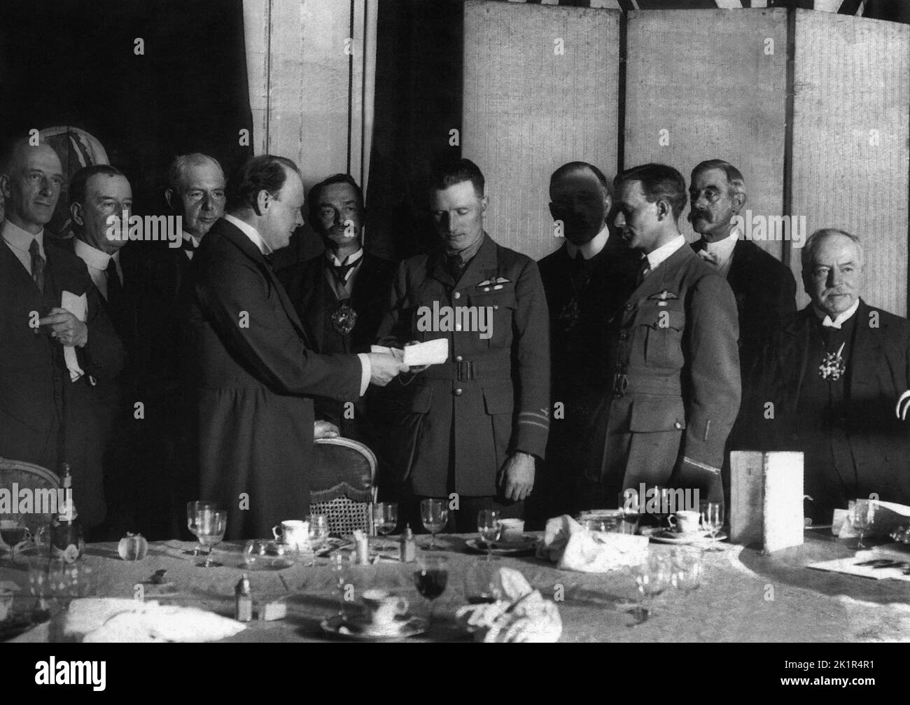 Winston Churchill presenting the £10000 prize to aviators Alcock and ...
