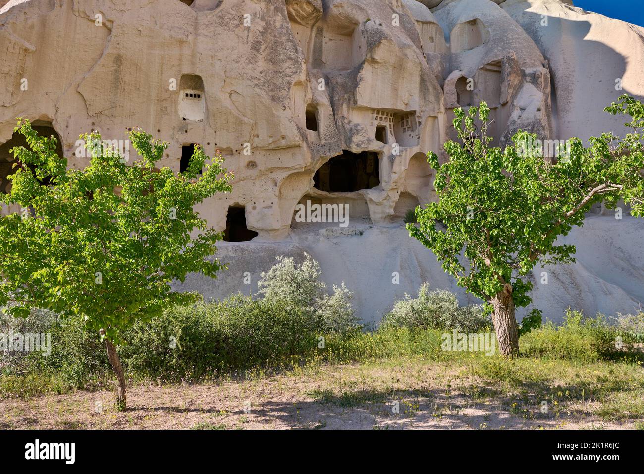 Carved Rock Houses or cave dwellings in landscape of Rose Valley Goreme ...