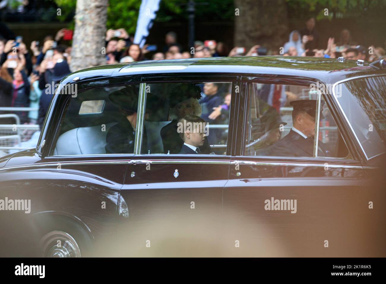 (L-R) Limousine with Princess Catherine of Wales, Queen Camilla, Prince ...