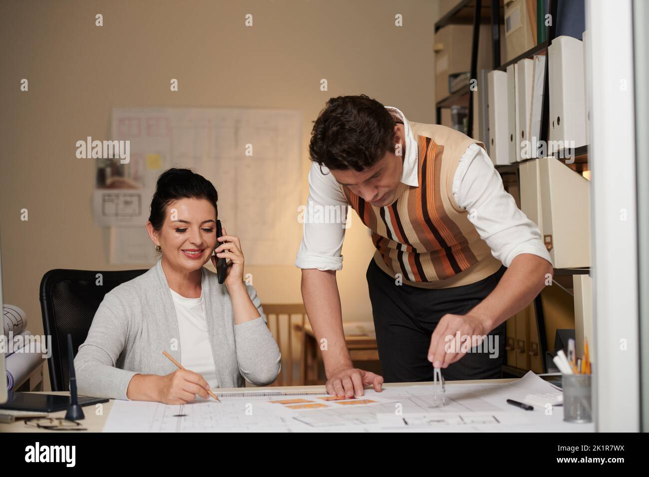 Team of civil engineers working on big project at architectural bureau ...