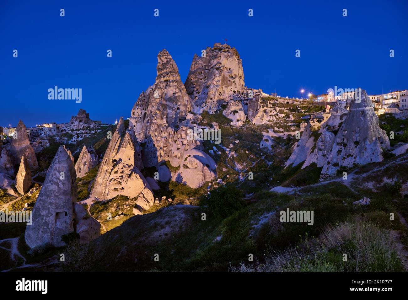 Uchisar castle, Twilight photo of the perforated castle rock of Uçhisar ...