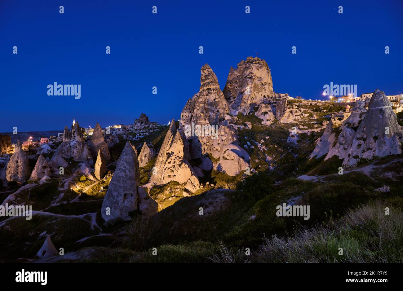 Uchisar castle, Twilight photo of the perforated castle rock of Uçhisar ...