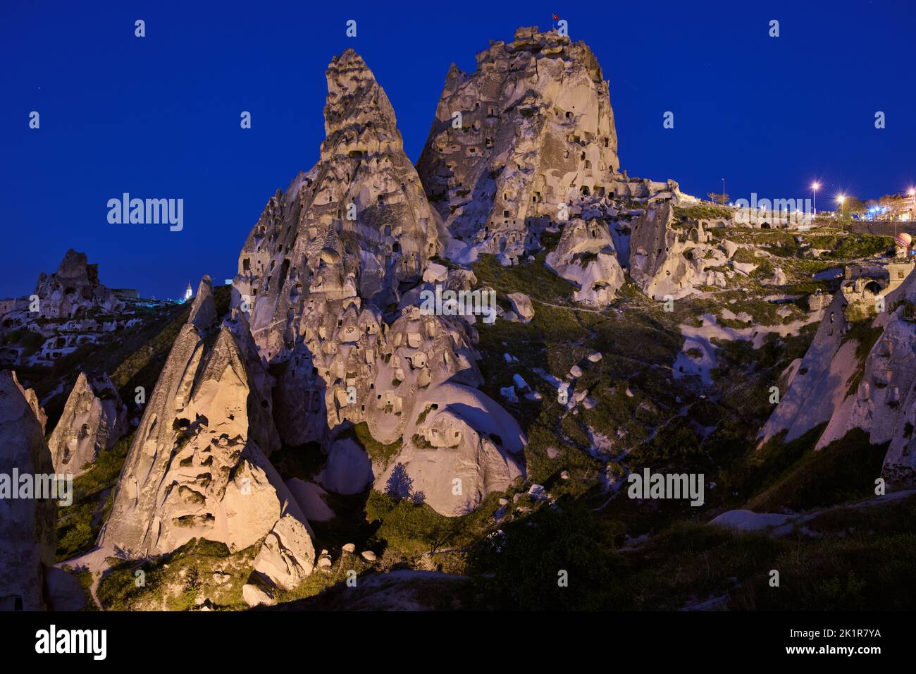 Uchisar castle, Twilight photo of the perforated castle rock of Uçhisar ...