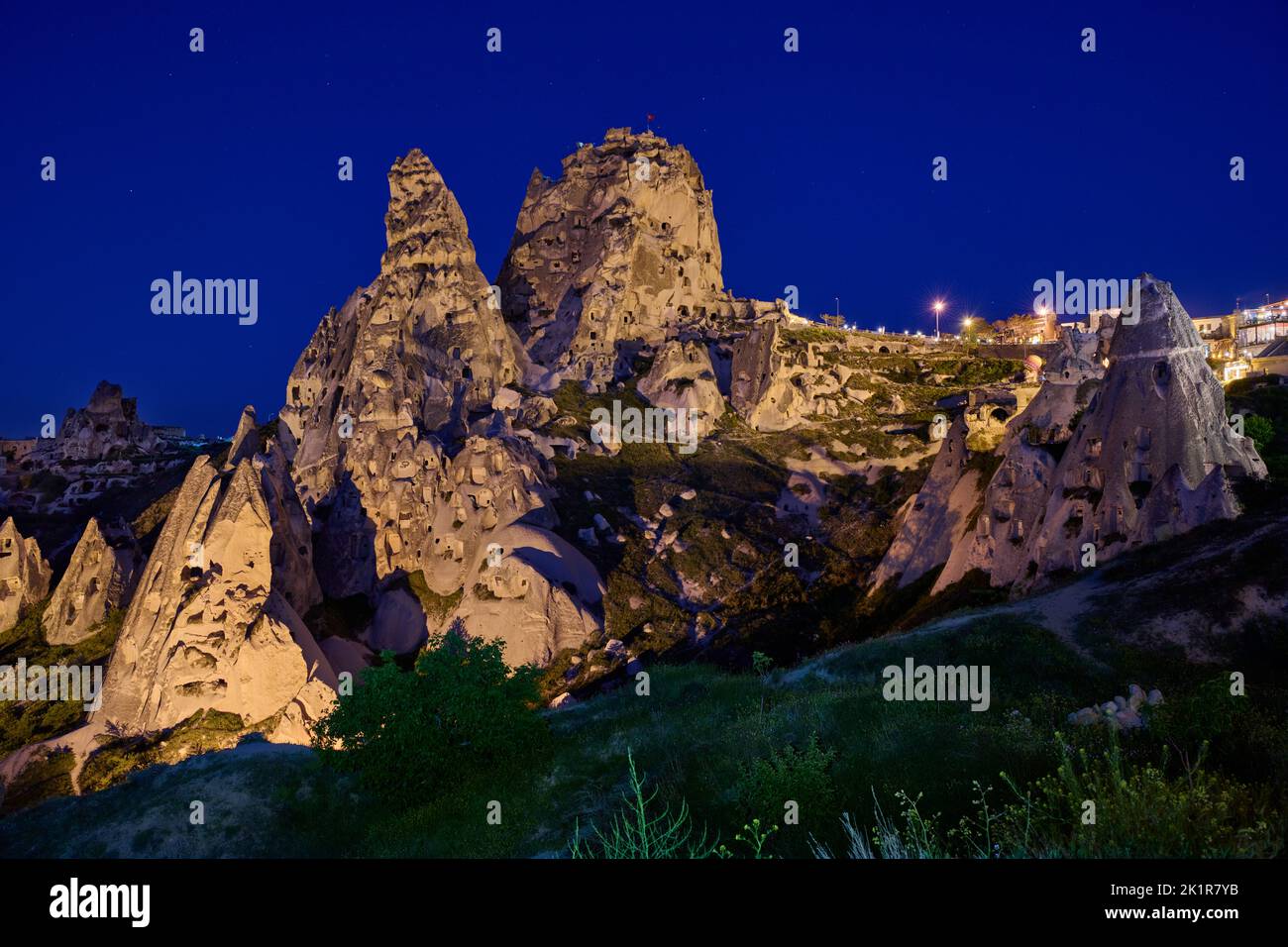 Uchisar castle, Twilight photo of the perforated castle rock of Uçhisar ...