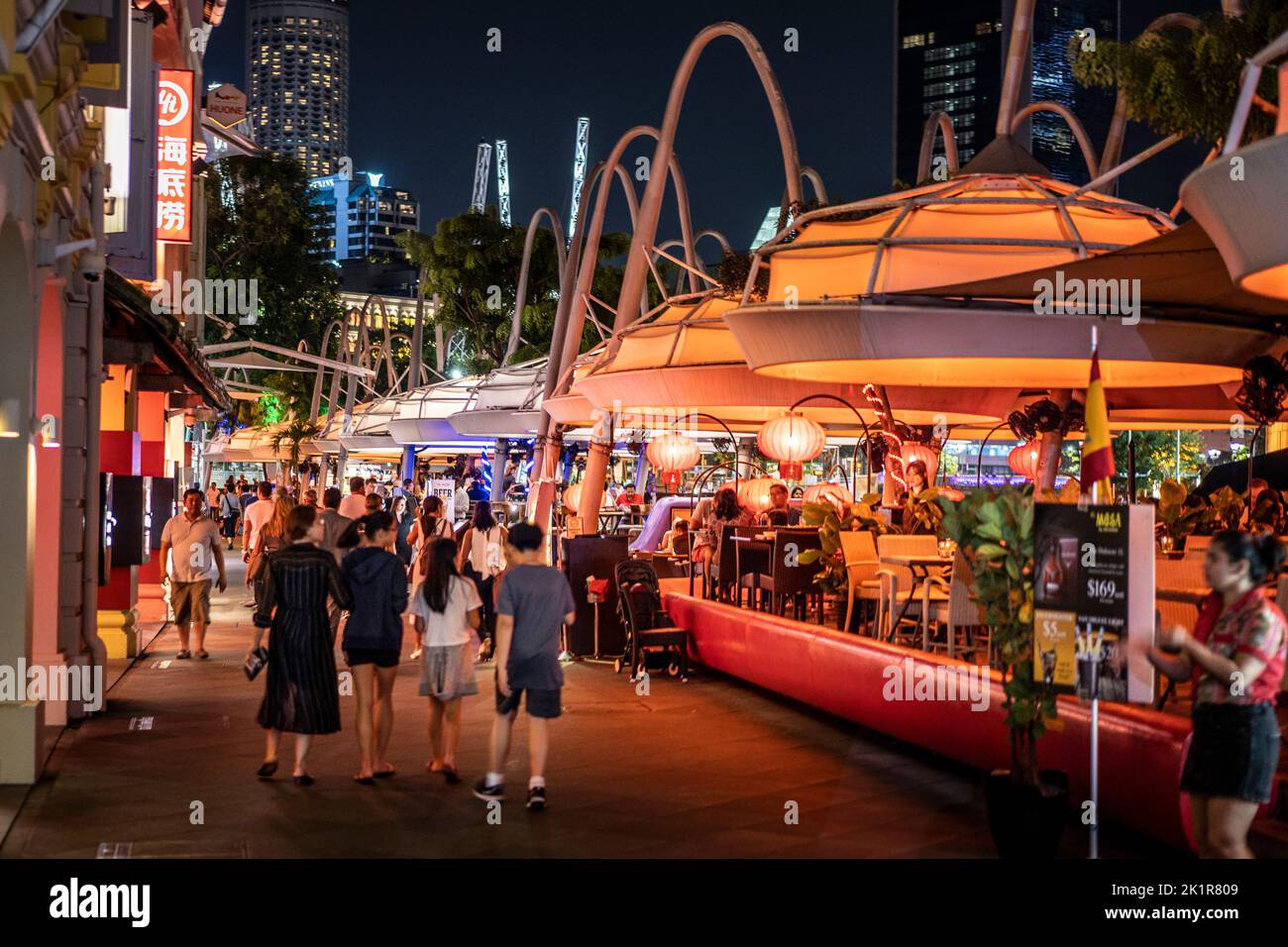 Clarke Quay on Singapore River illuminated by coloured lights with ...