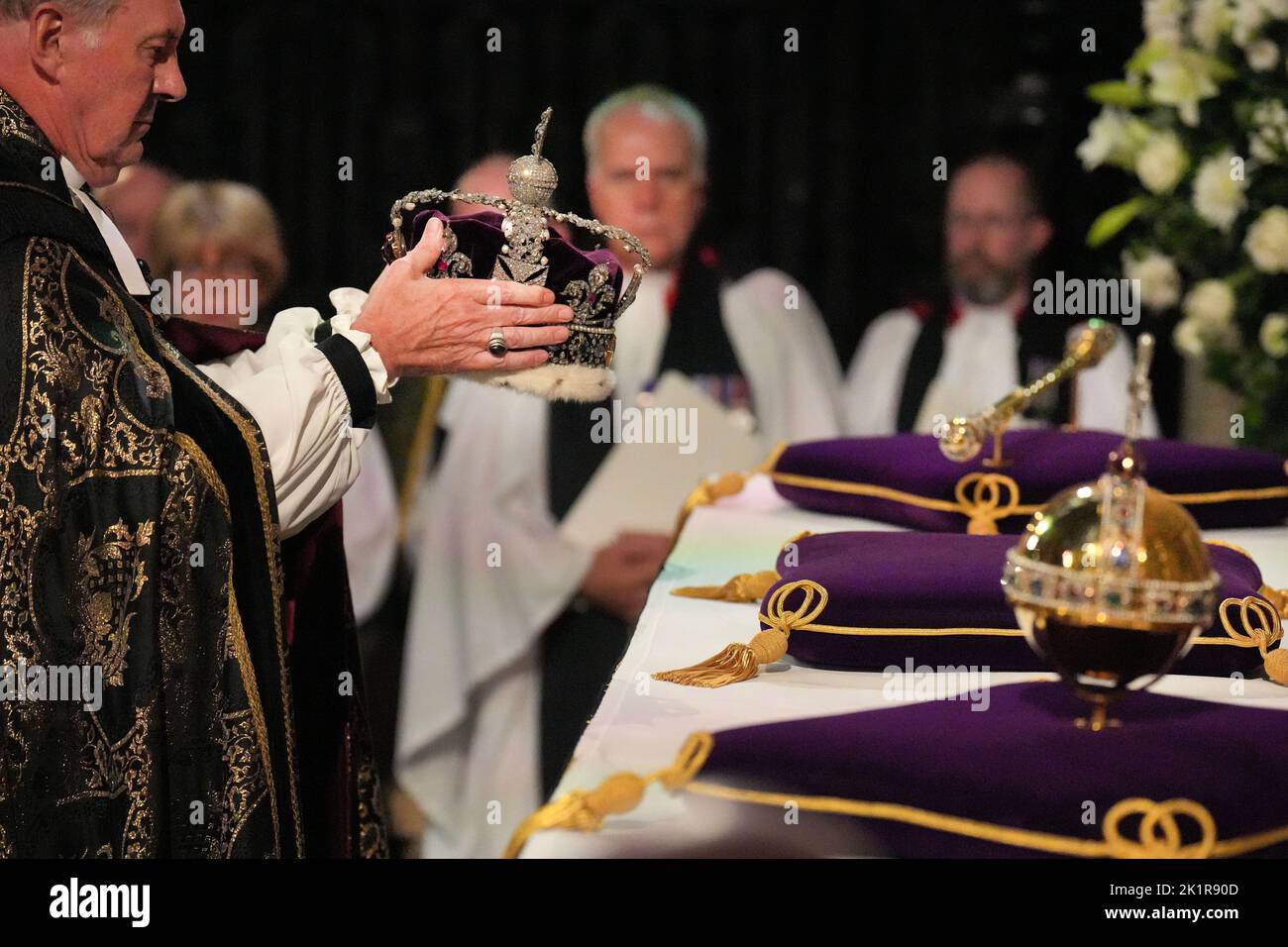 The Dean of Windsor, The Rt Revd David Conner, places the Imperial ...