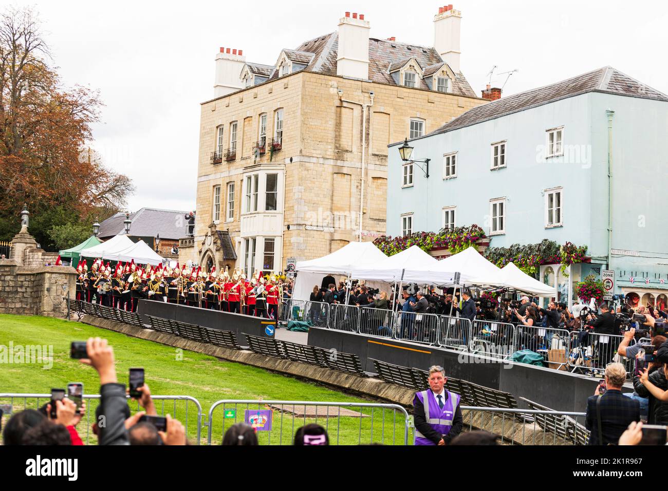 A crowd of people outside Windsor Castle watching the Royal Guards ...