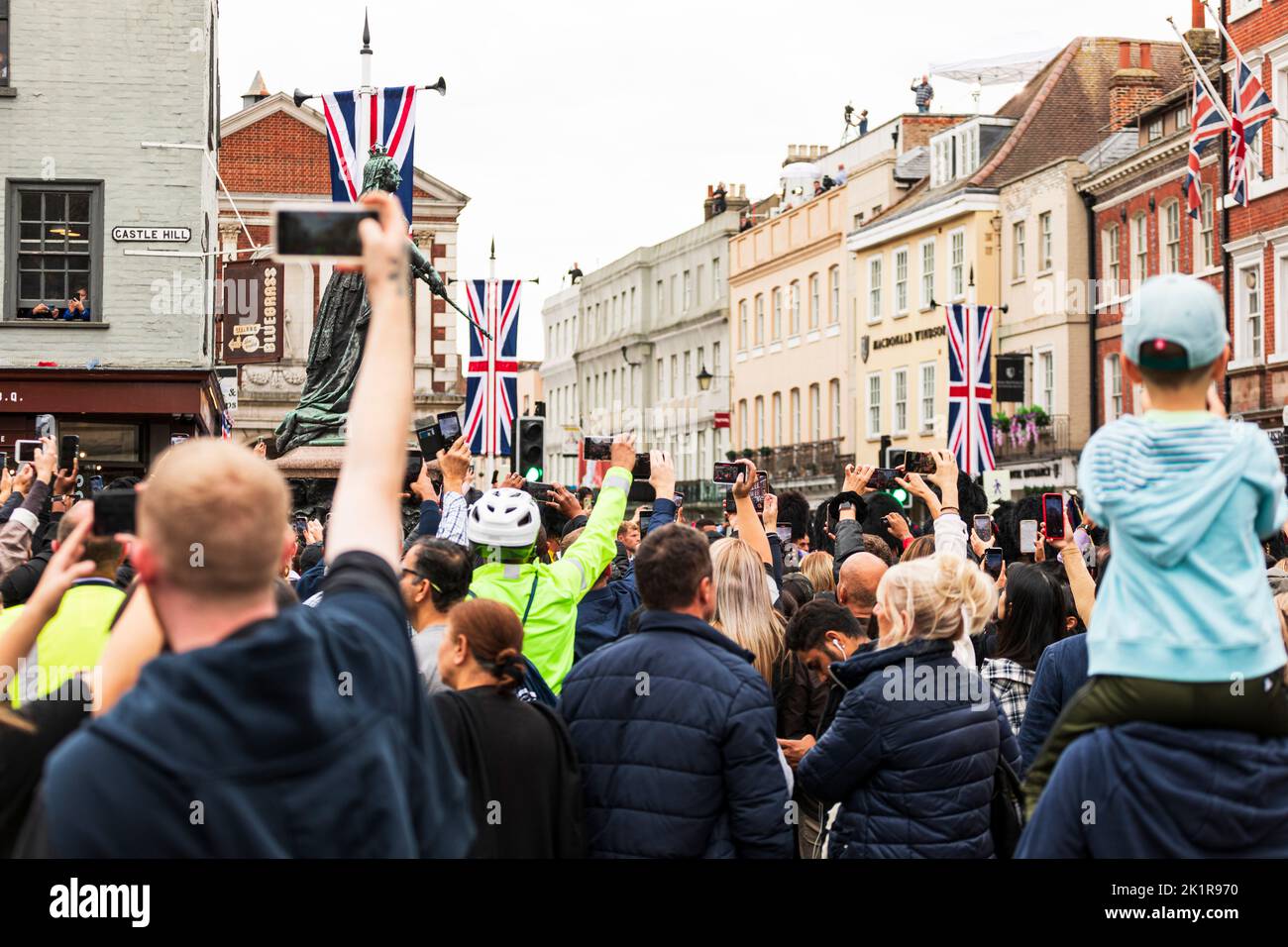 A crowd of people outside Windsor Castle watching the Royal Guards ...