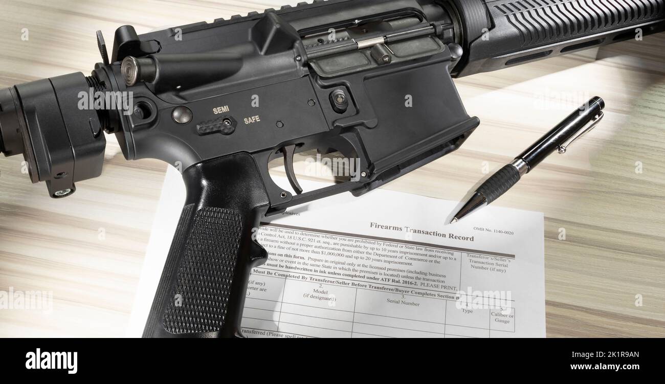 Weapon with public domain purchase form and pen Stock Photo - Alamy