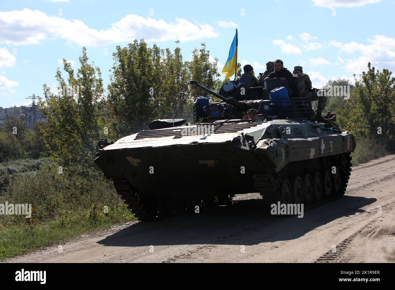 IZIUM, UKRAINE - SEPTEMBER 19, 2022 - Ukrainian servicemen ride on top ...