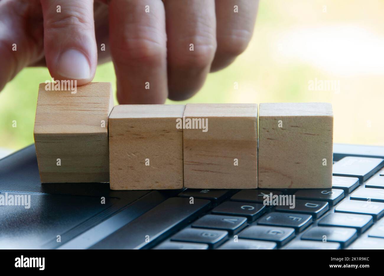 Finger flipping a wooden block with customizable space for text or ...