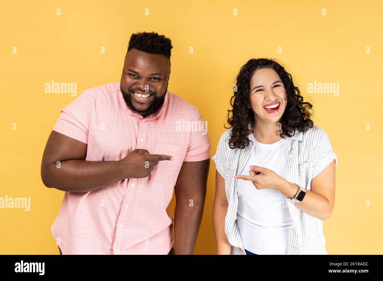 Funny smiling woman pointing hi-res stock photography and images - Alamy