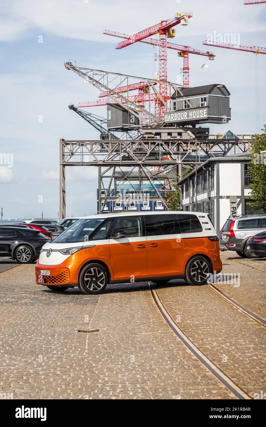 A vertical shot of an orange Volkswagen VW ID Buzz Pro modern Electric ...