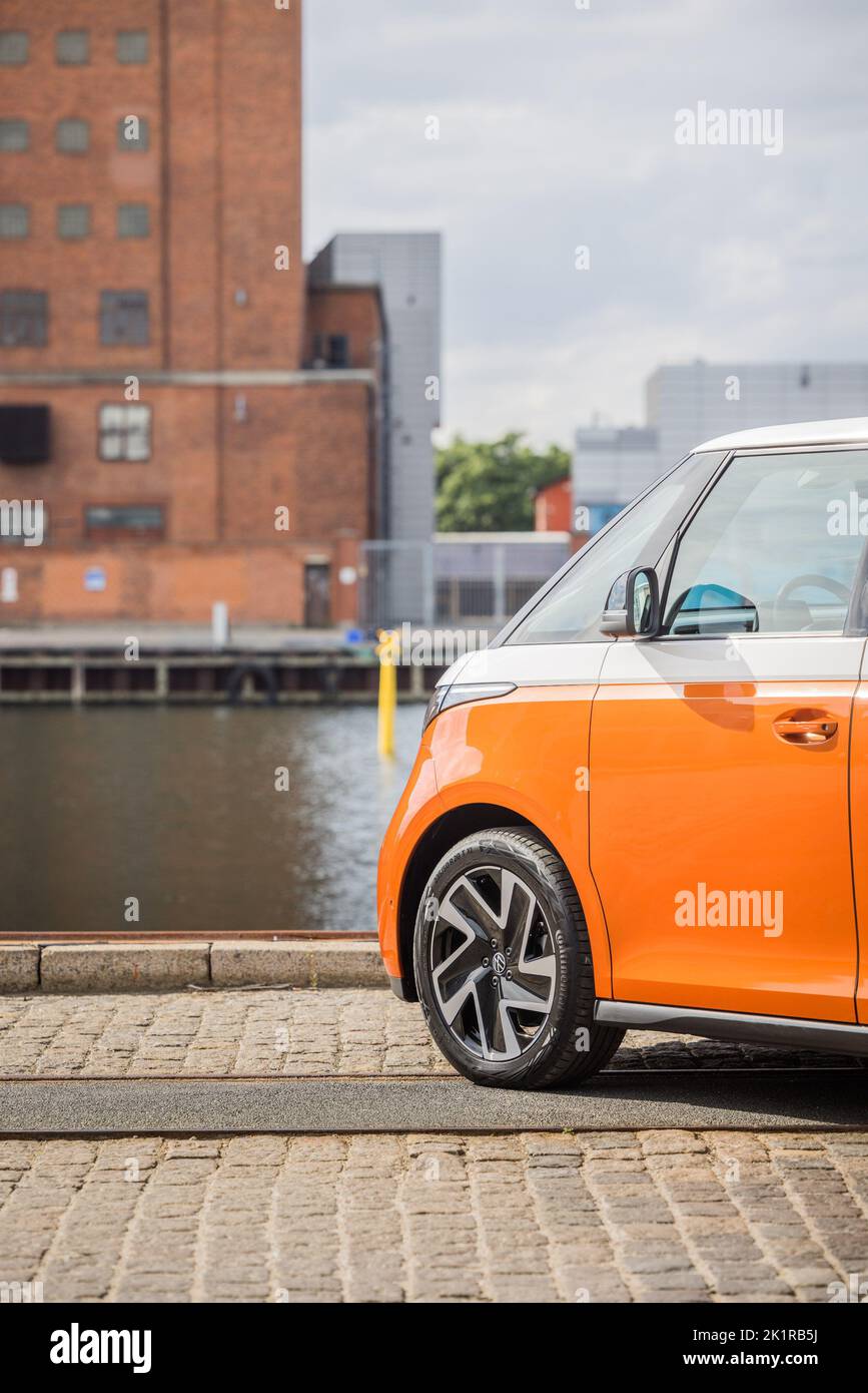 A vertical shot of an orange Volkswagen VW ID Buzz Pro modern Electric ...