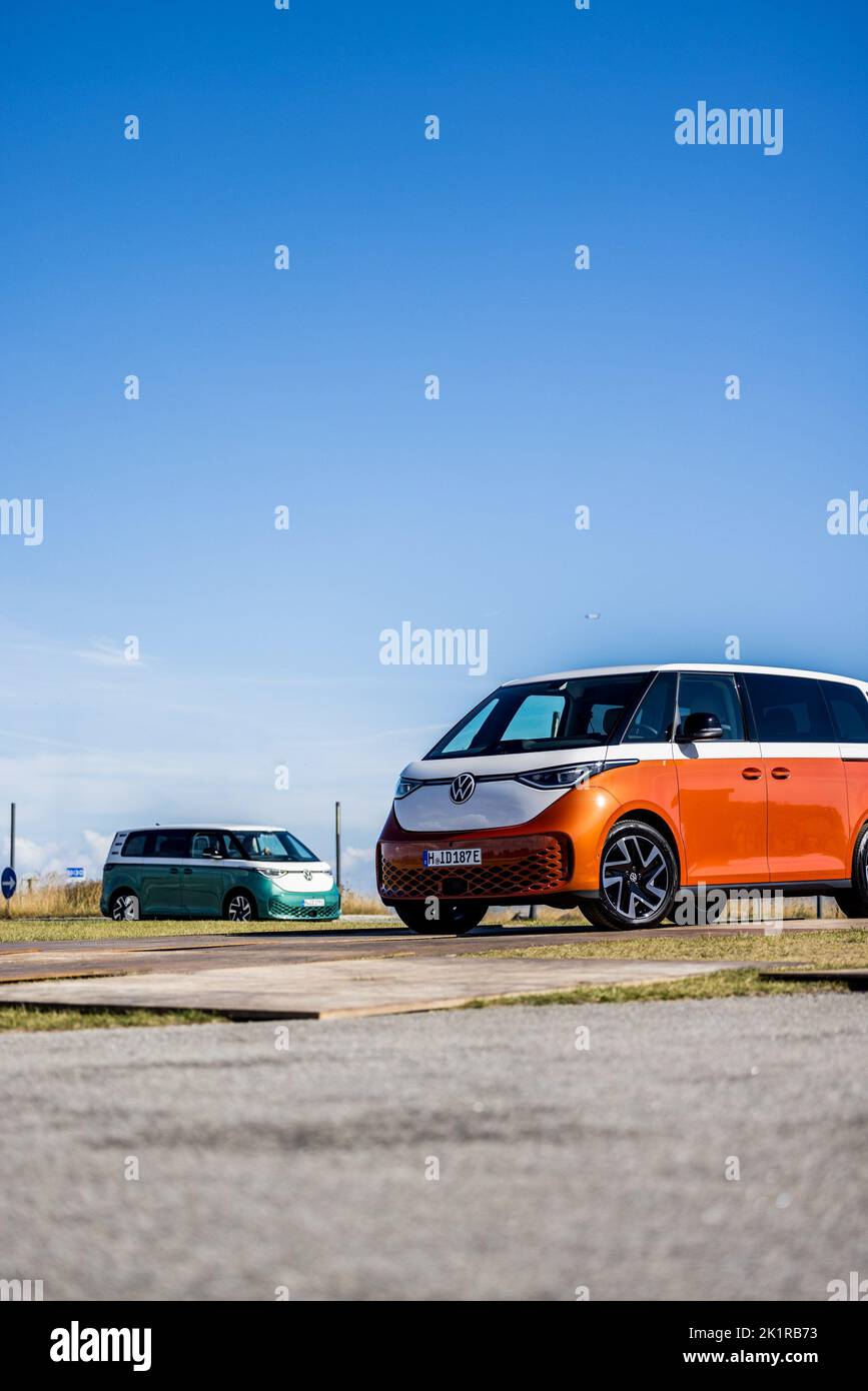 A vertical shot of an orange Volkswagen VW ID Buzz Pro modern Electric ...