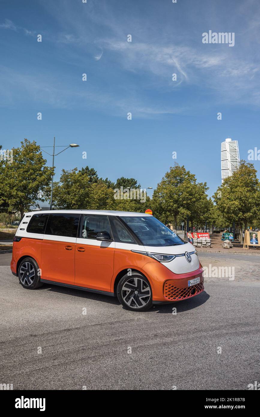 A vertical shot of an orange Volkswagen VW ID Buzz Pro modern Electric ...