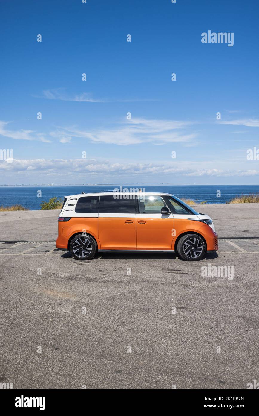 A vertical shot of an orange Volkswagen VW ID Buzz Pro modern Electric ...