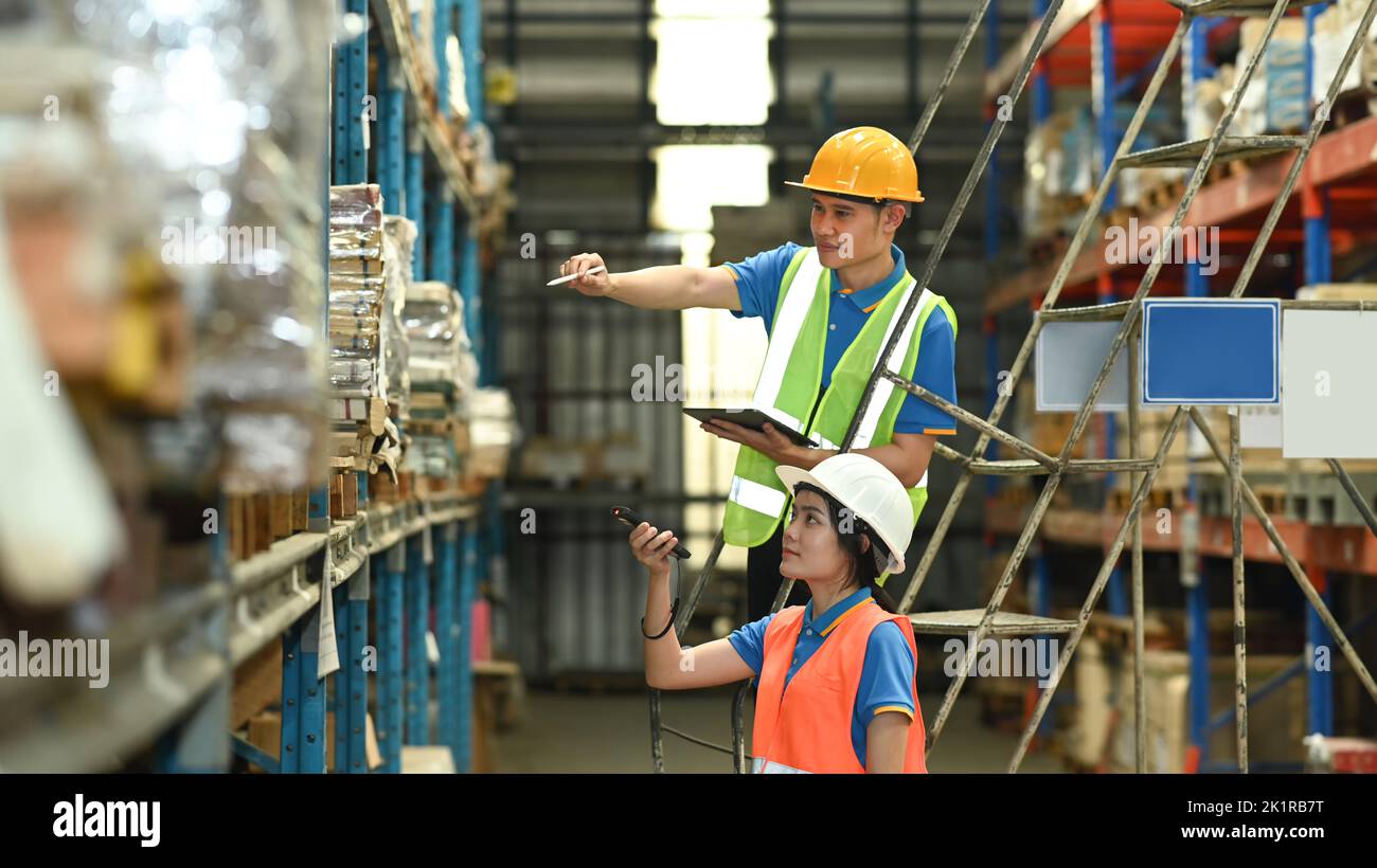 Workers checking boxes in distribution hi-res stock photography and ...