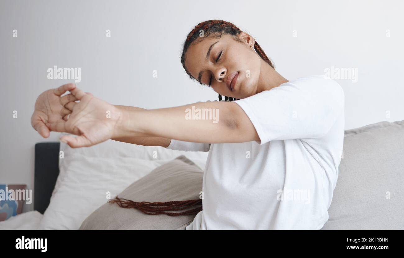 Health, wellness and zen, woman stretching on bed in the morning to ...