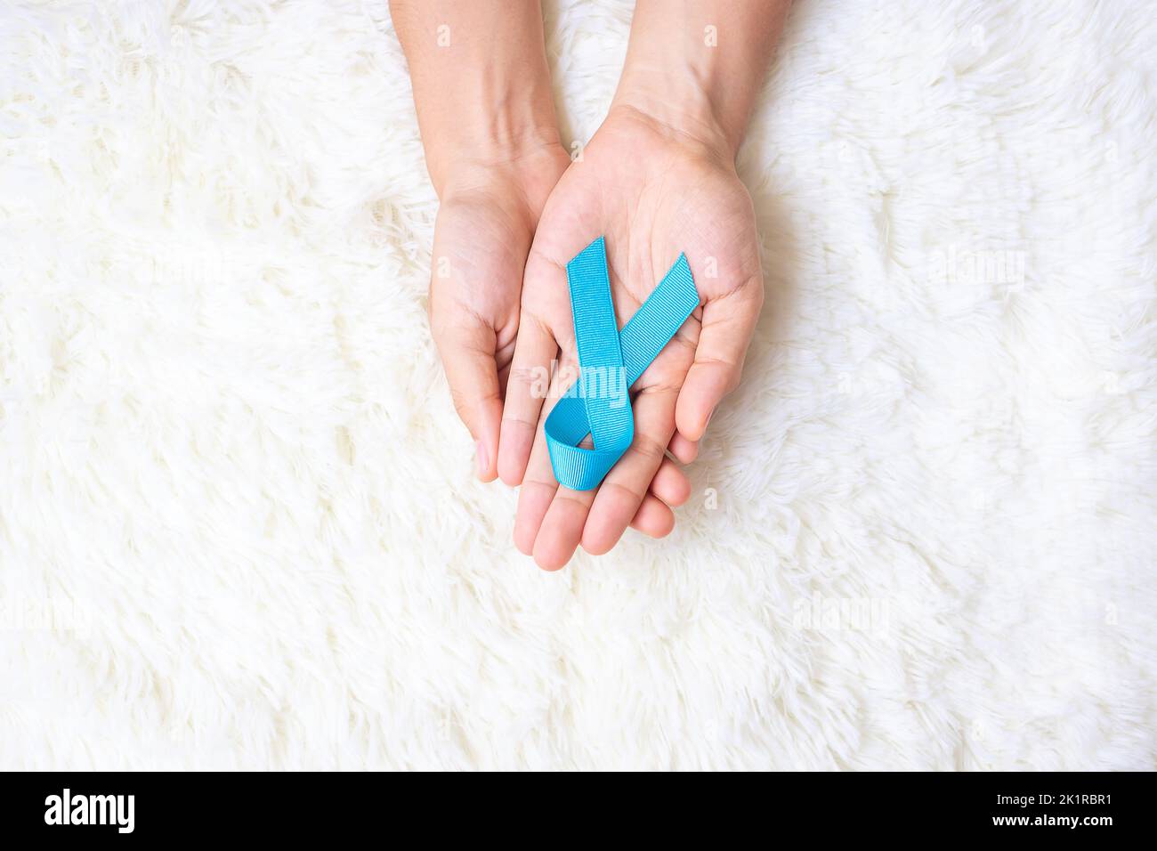 November Prostate Cancer Awareness month, Man holding light Blue Ribbon ...