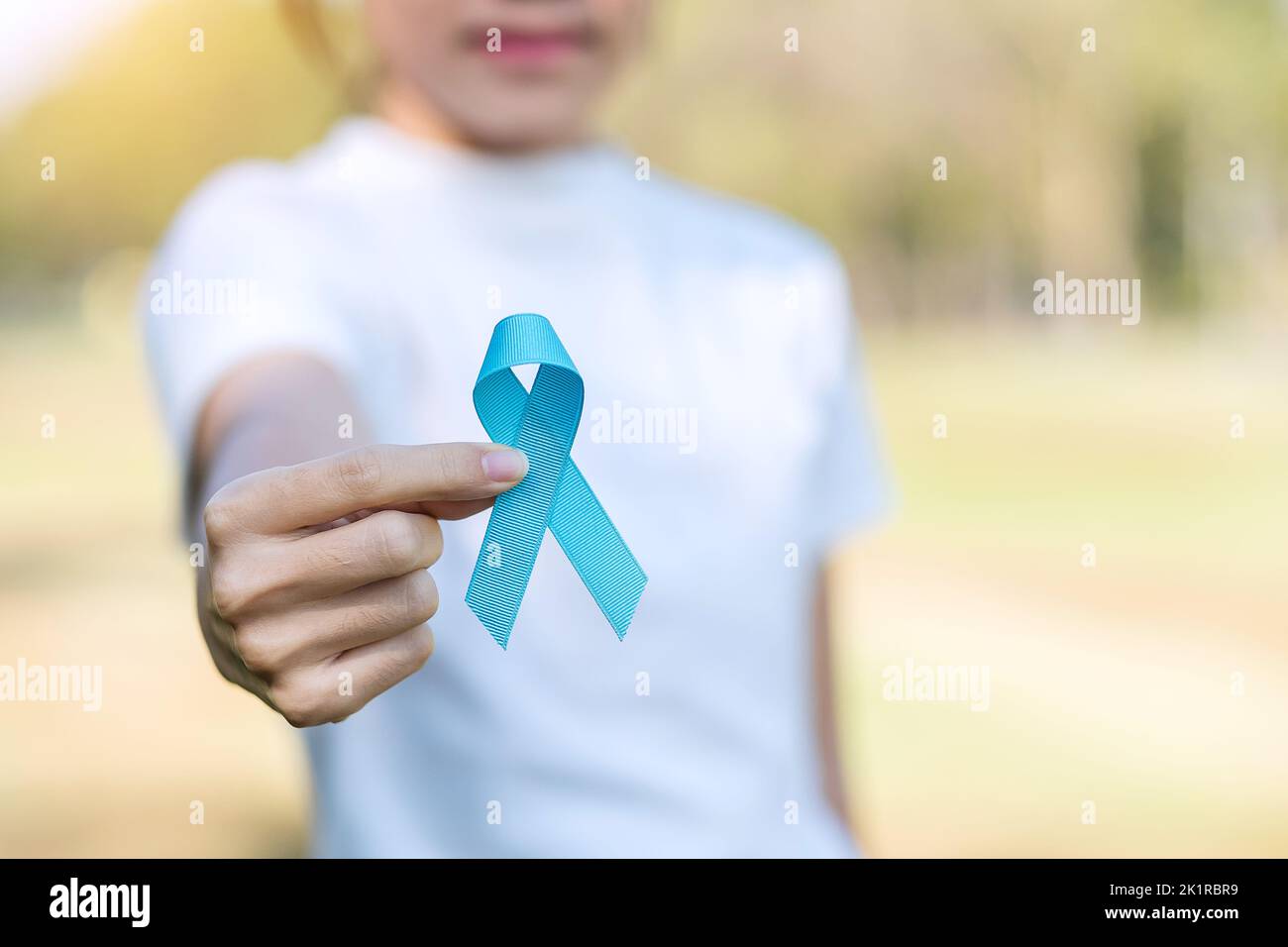 November Prostate Cancer Awareness Month Woman Holding Blue Ribbon For