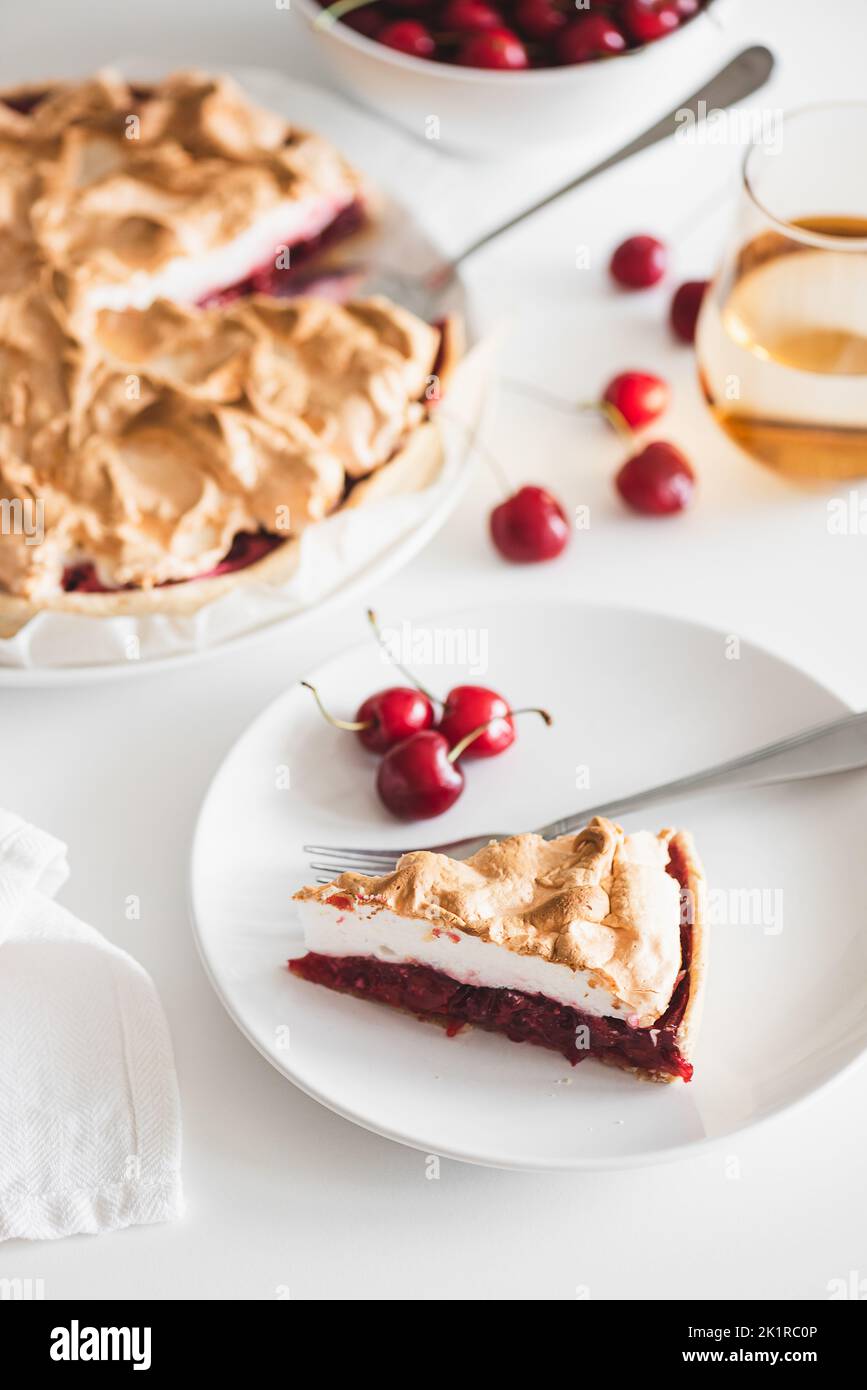 Plate with tasty cherry pie on white background. Top view. Front view ...