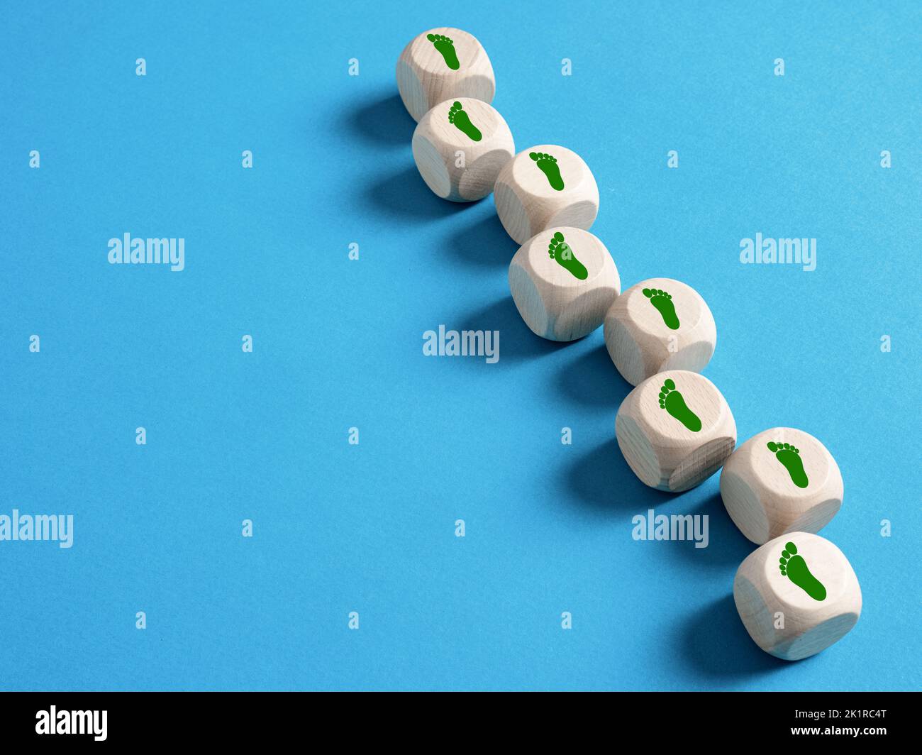 Ecological footprint symbols on wooden cubes. Carbon footprint eco ...