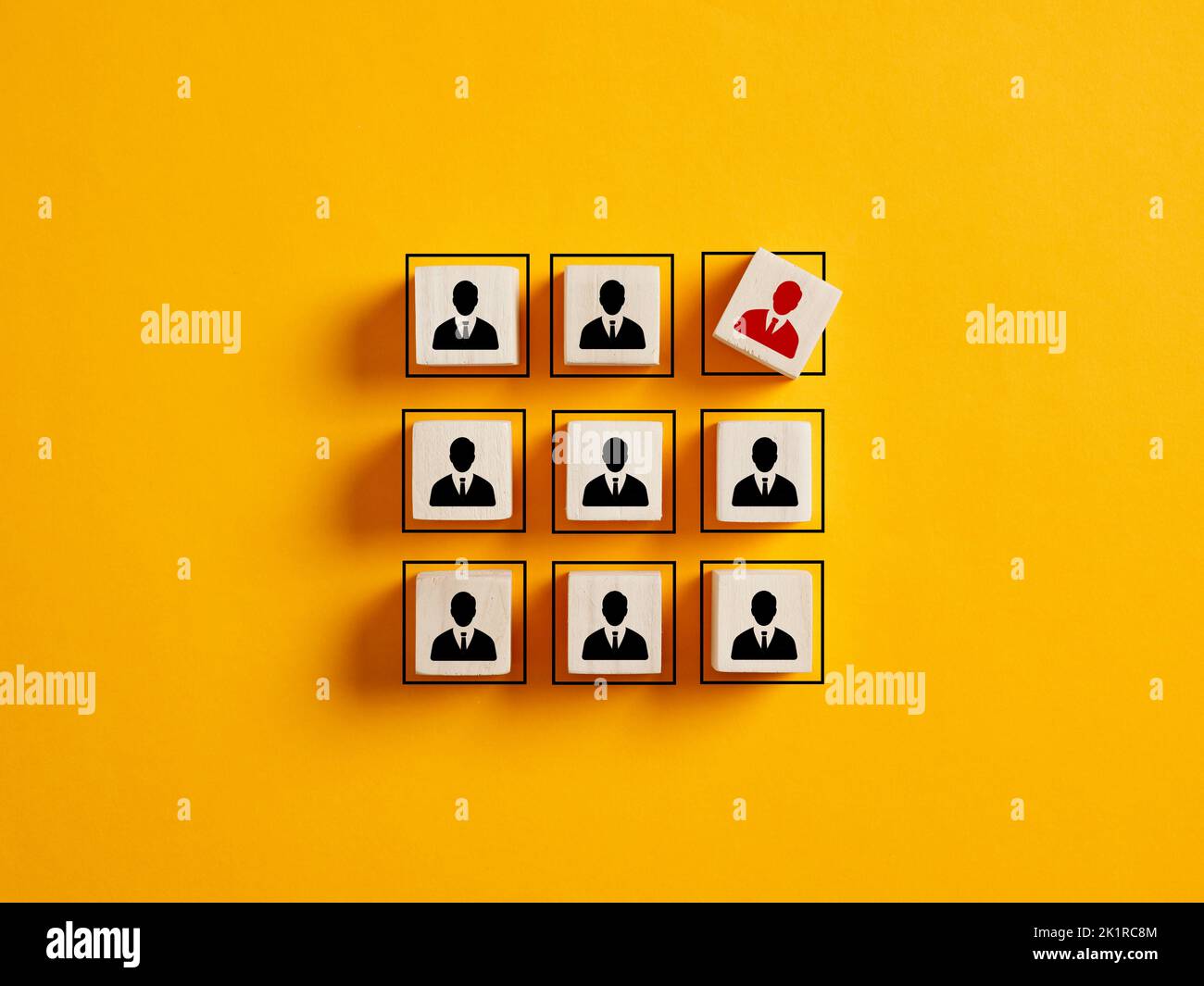 Employee icons on wooden cubes. Firing an employee from the team ...