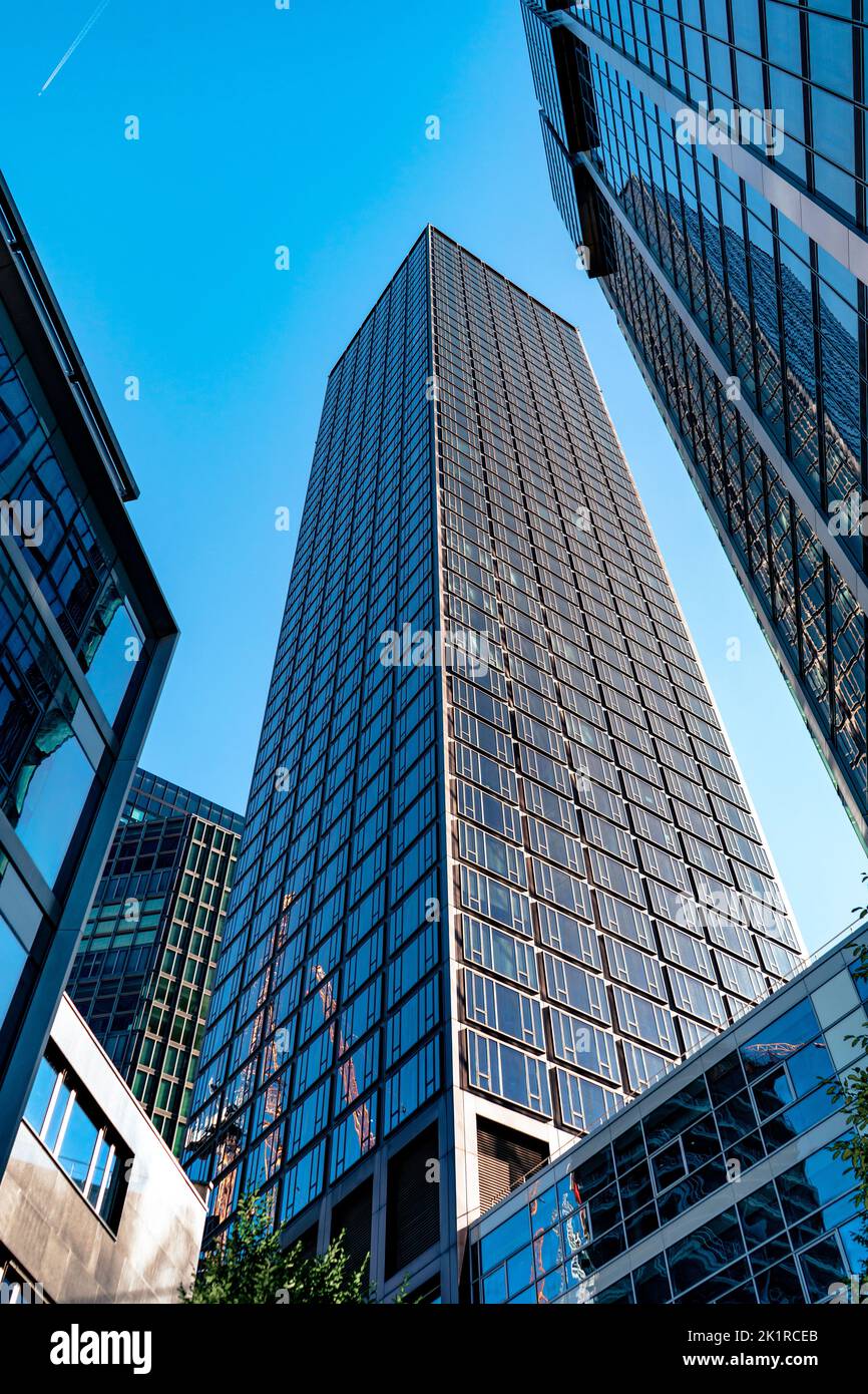 A vertical low angle shot of tall skyscrapers in the downtown Stock ...