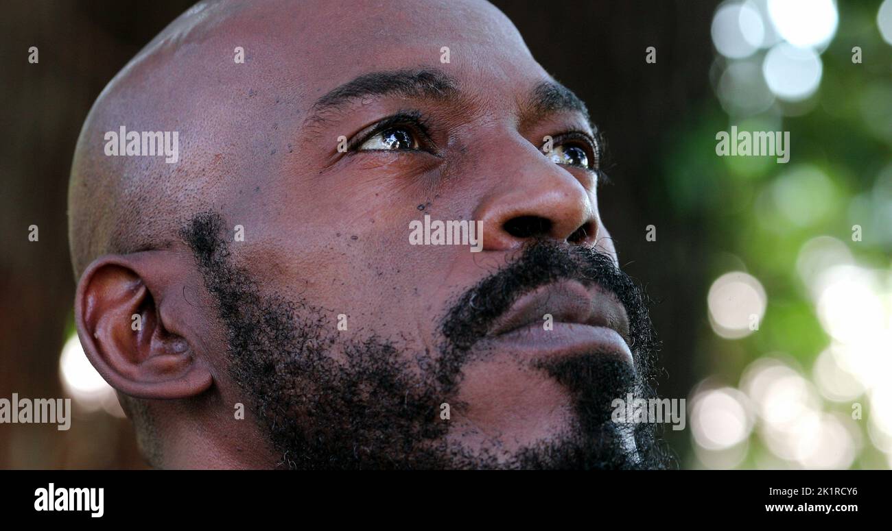 African man face looking up at sky Stock Photo - Alamy