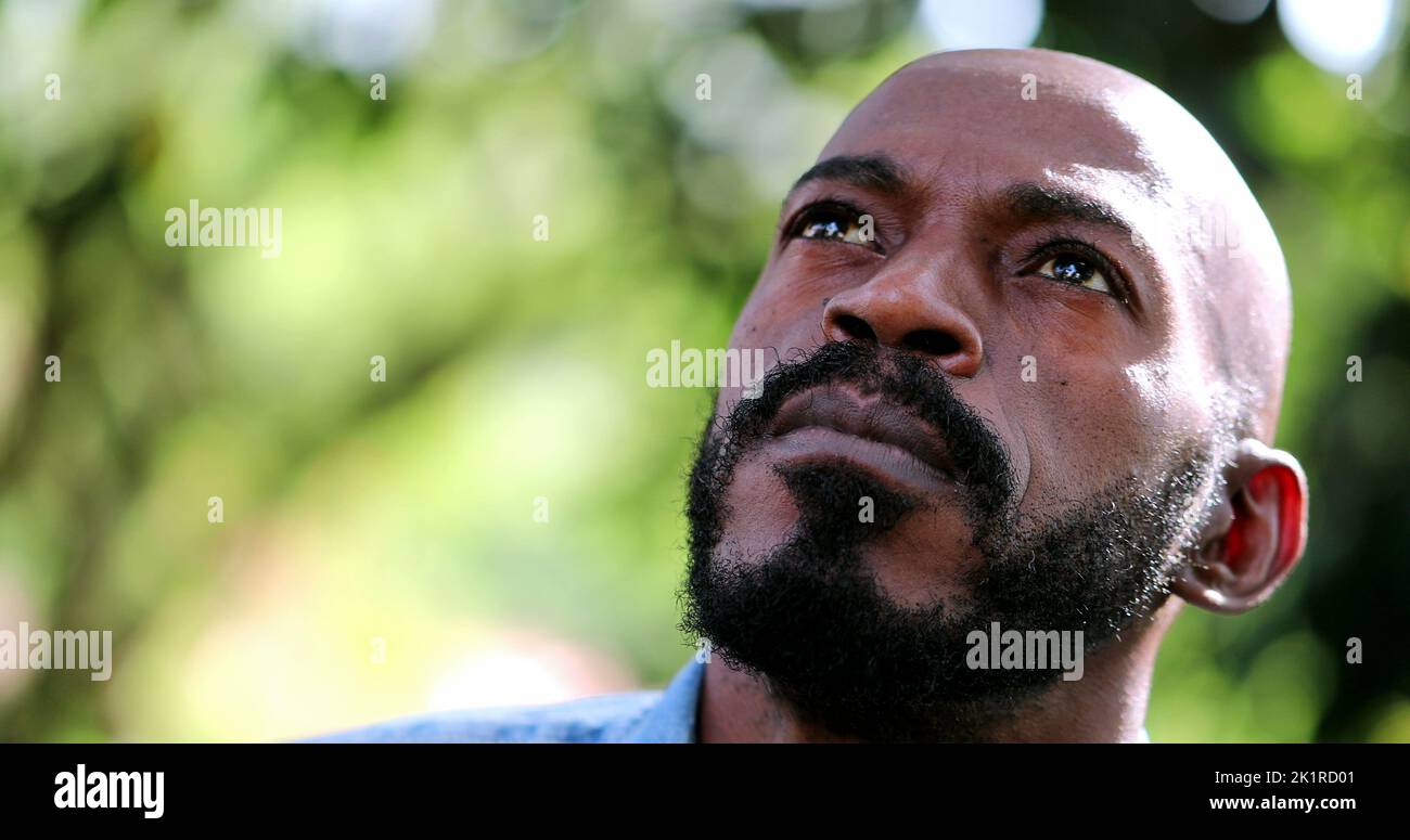 African man opening eyes sky hi-res stock photography and images - Alamy