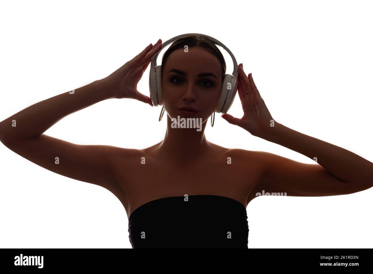 Woman silhouette. Audio sound. Modern technology. Dark contrast outline ...