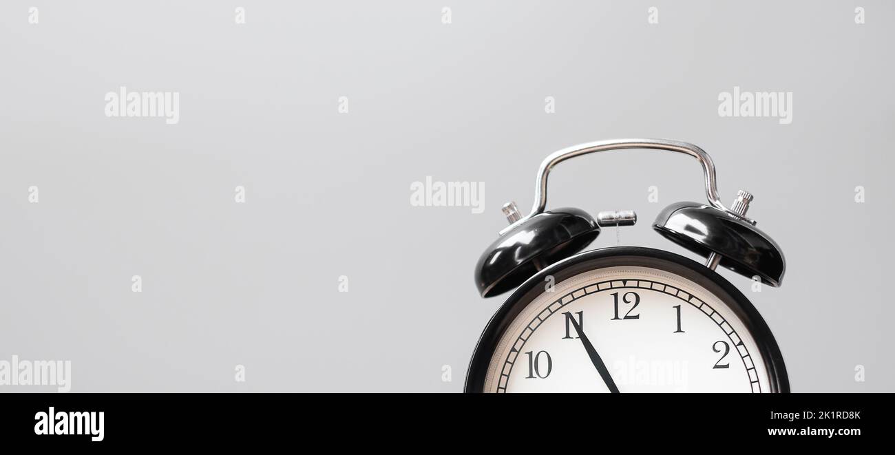 Vintage alarm clock on wooden table background and copy space for text ...