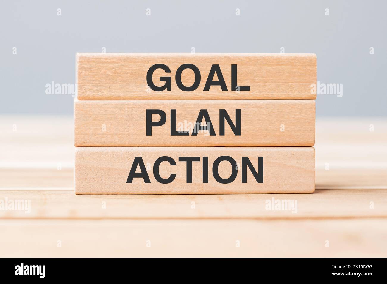 wooden block with GOAL, PLAN and ACTION on table background Stock Photo ...