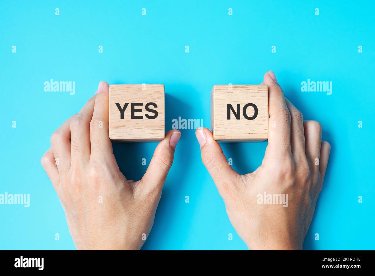 Hand choosing Yes or No block. Answer, question and decision concept ...